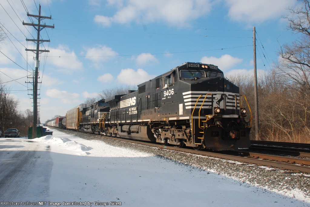 NS 9406 heads east with yet anoqehr mixep.